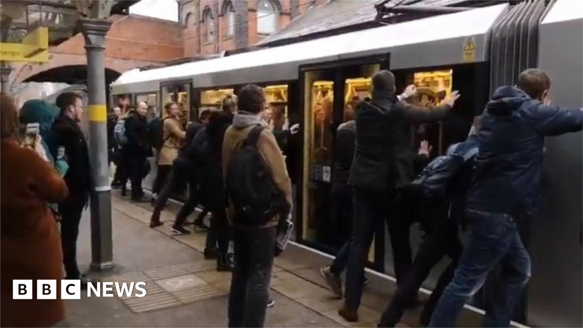 Metrolink passengers asked to push stricken tram - BBC News