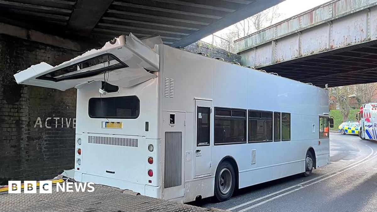 Children hurt as roof of school bus ripped off by Coppull bridge - BBC News