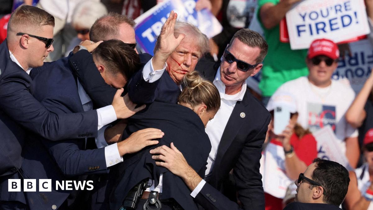 Sniper shot Trump gunman's weapon and delayed him - report - BBC News