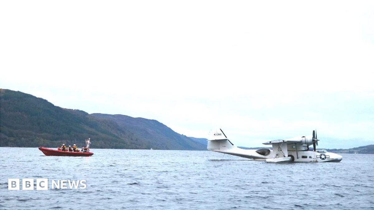 Stranded aircraft towed to safety by lifeboat - BBC News