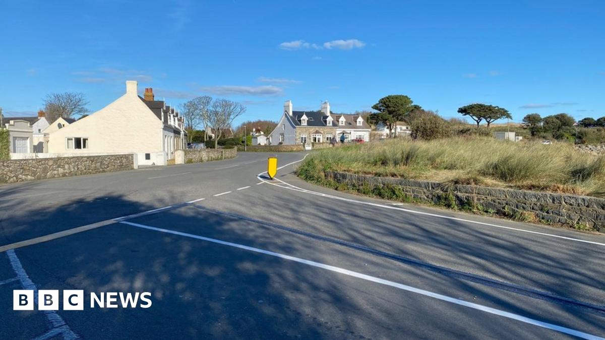 Pedestrian walkway and bollard installed on coastal road - BBC News