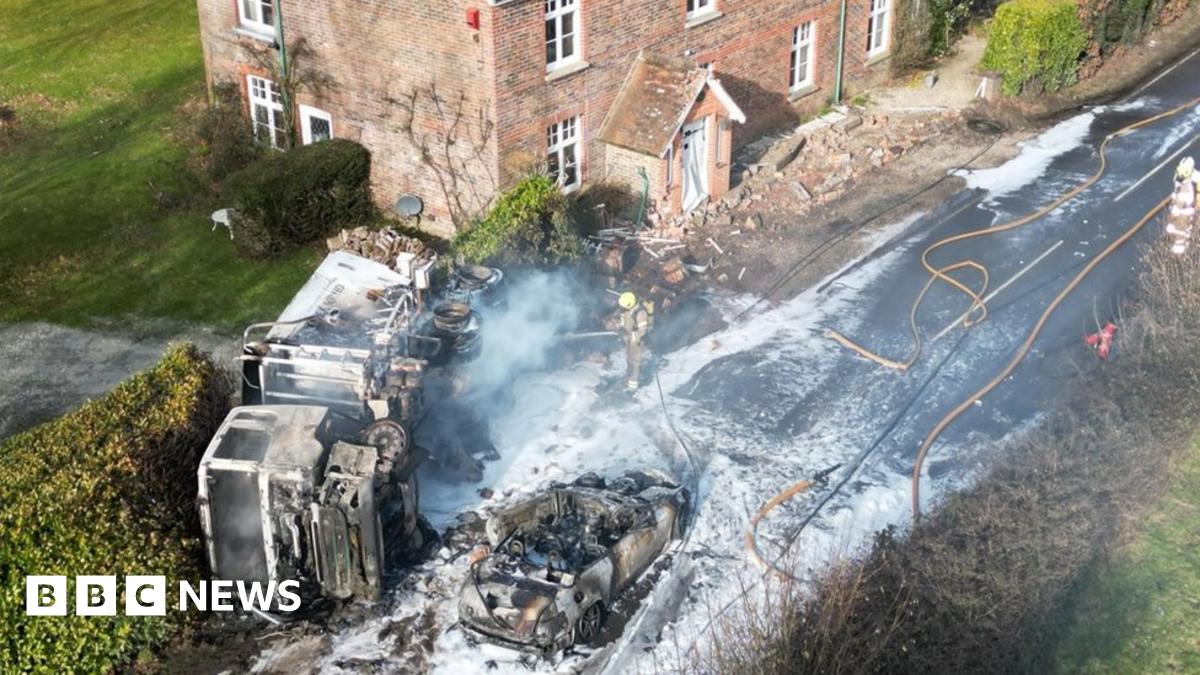 Crawley crash: Cement mixer overturns and catches fire - BBC News