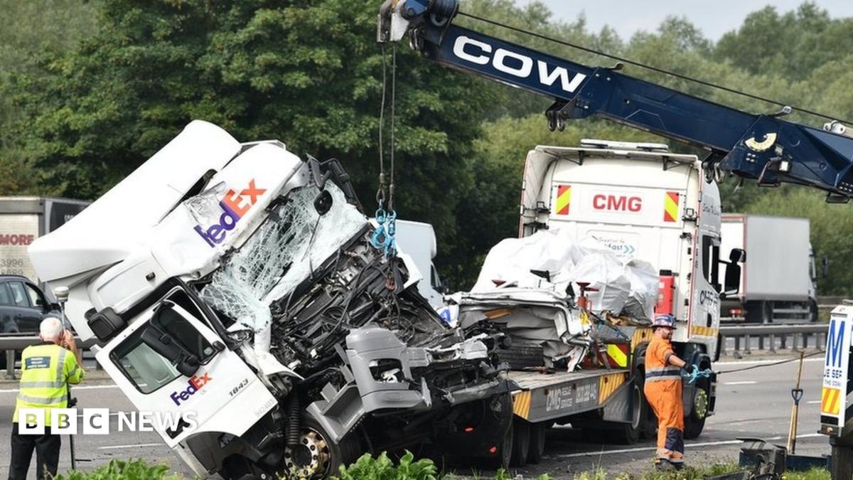 Lorry drivers charged over M1 fatal crash - BBC News