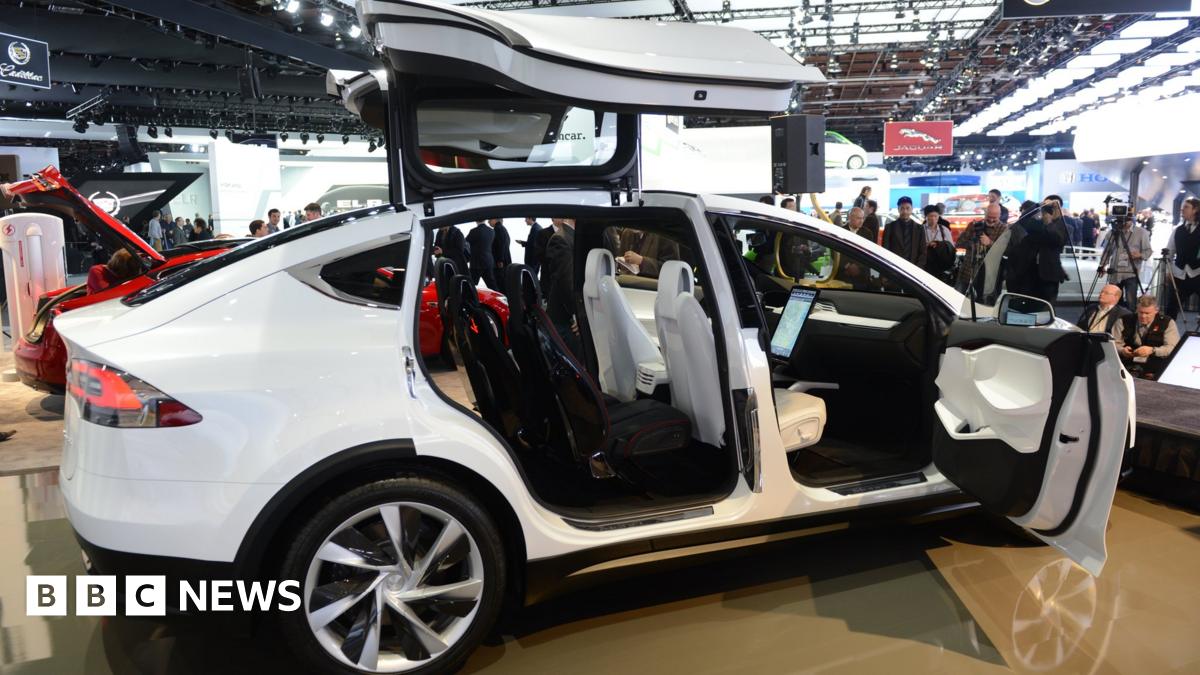 Tesla unveils Model X car with Falcon Wing doors - BBC News