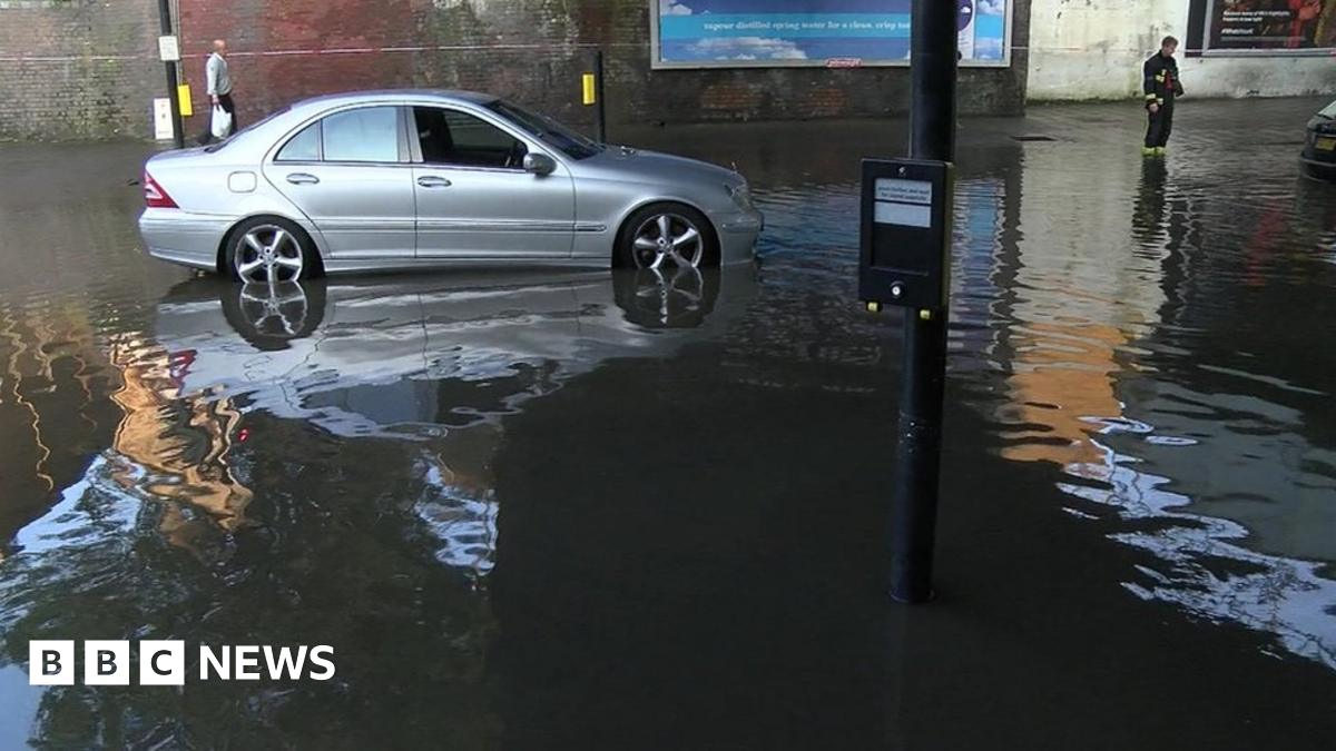 Children rescued as flash floods hit parts of UK - BBC News
