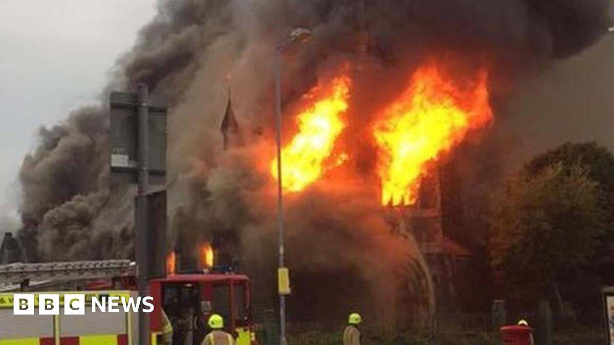 Homes evacuated as crews tackle Llanelli church fire - BBC News