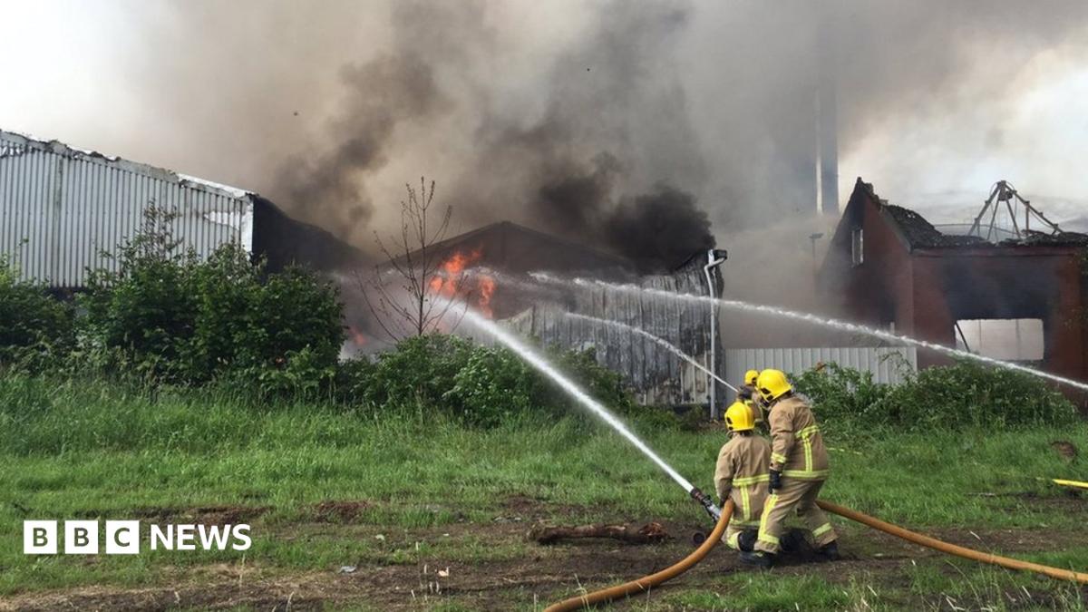 Fire crews tackle large fire at Lancashire sawdust mill - BBC News