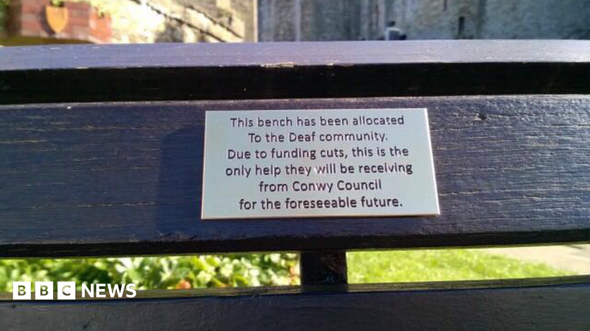 Conwy plaque protests against deaf service cuts - BBC News