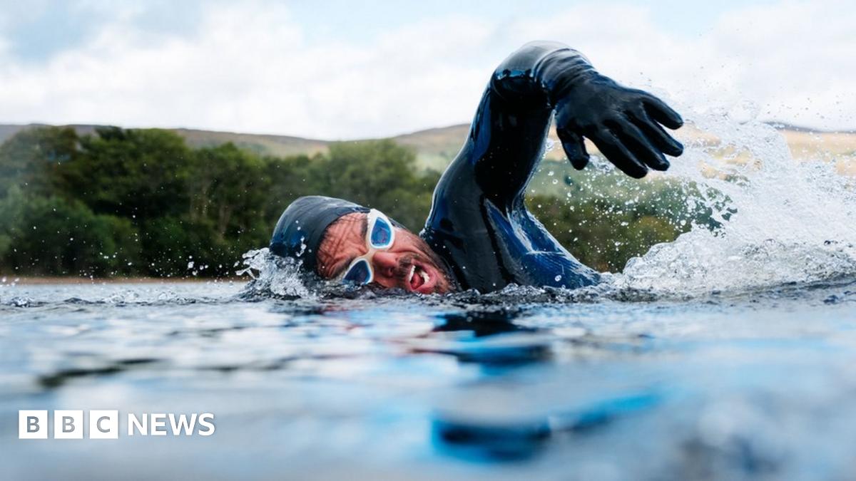 Ross Edgley ends longest non-stop lake swim in heatwave - BBC News