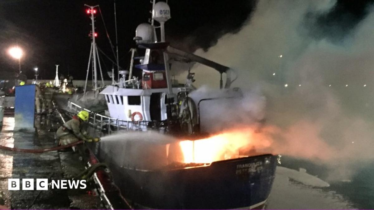 Man charged after Peterhead harbour boat fire - BBC News