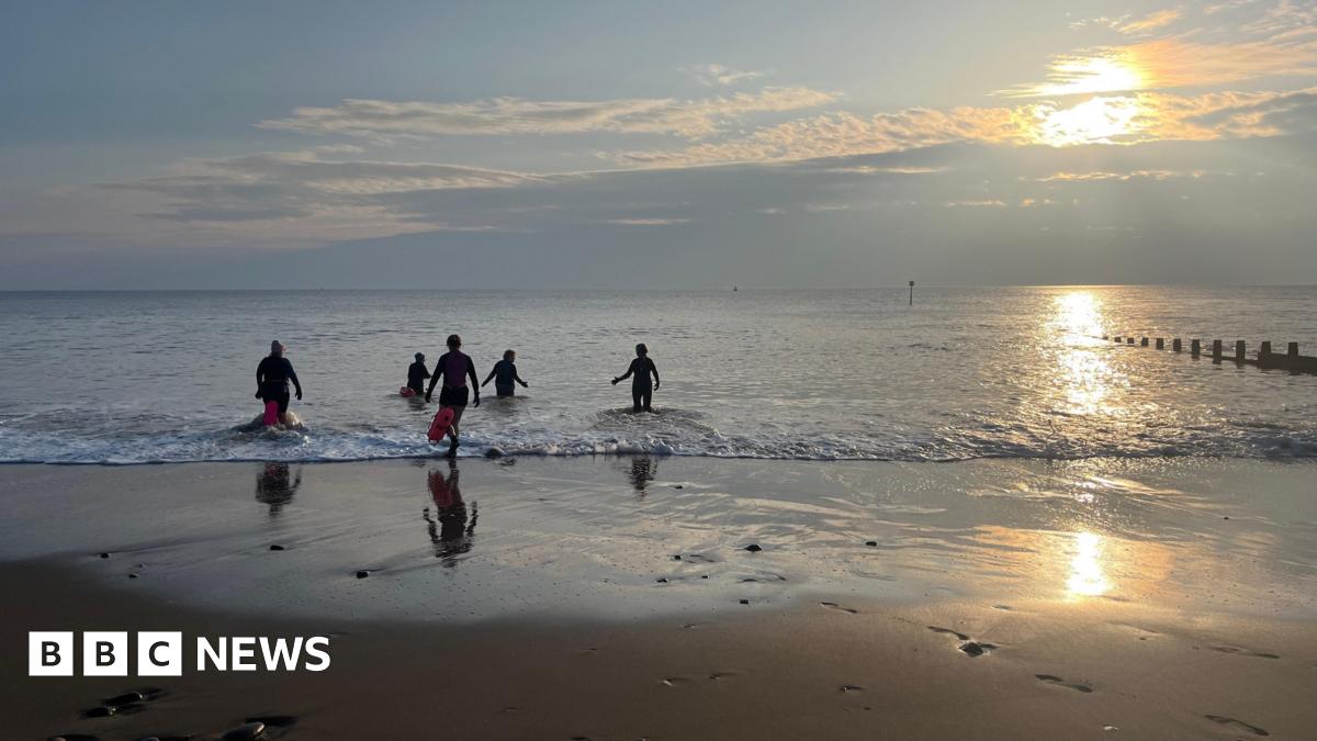Devon swimmers warned about dangers of cold water shock - BBC News