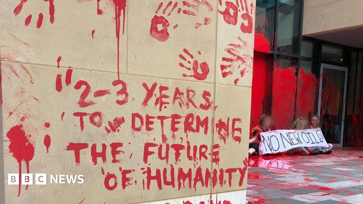 Six arrests after activists threw paint at a UK government building in ...
