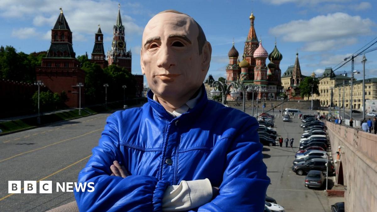 Russian 'Putin mask' activist claims asylum in Ukraine - BBC News