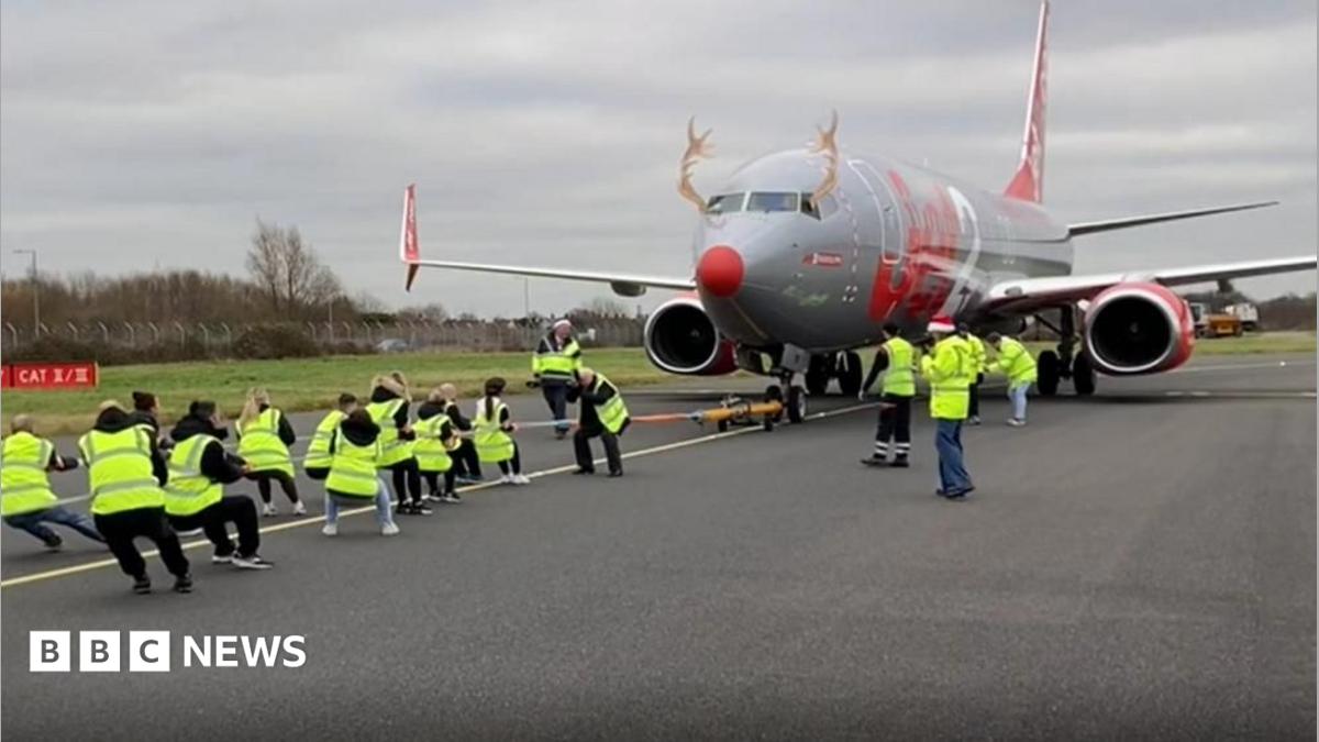 Jet dragged along by teams in Liverpool charity challenge - BBC News