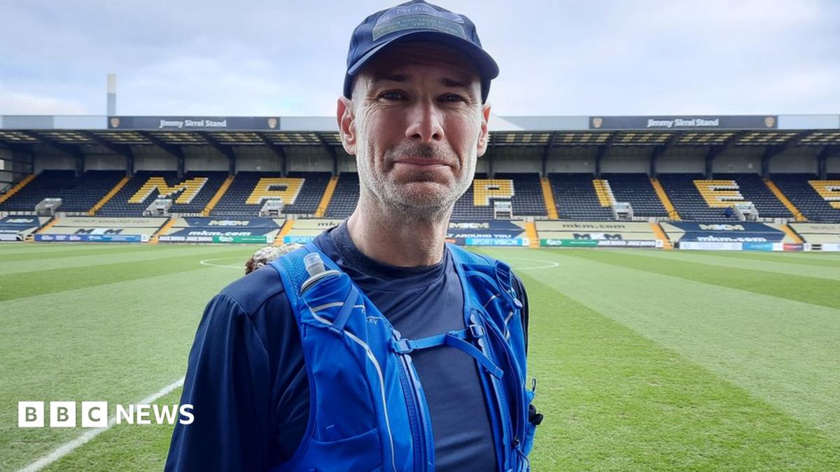Dad completes charity run along entire length of M1 - BBC News