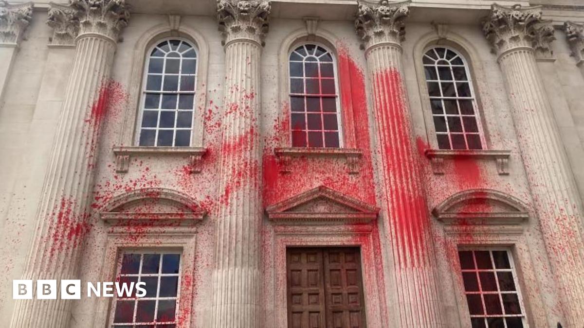 Cambridge university building sprayed with paint by protesters - BBC News