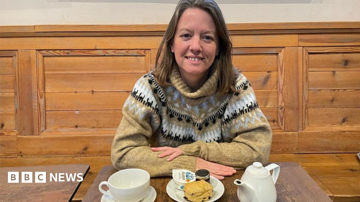 Woman completes 10-year National Trust scone-eating project - BBC News