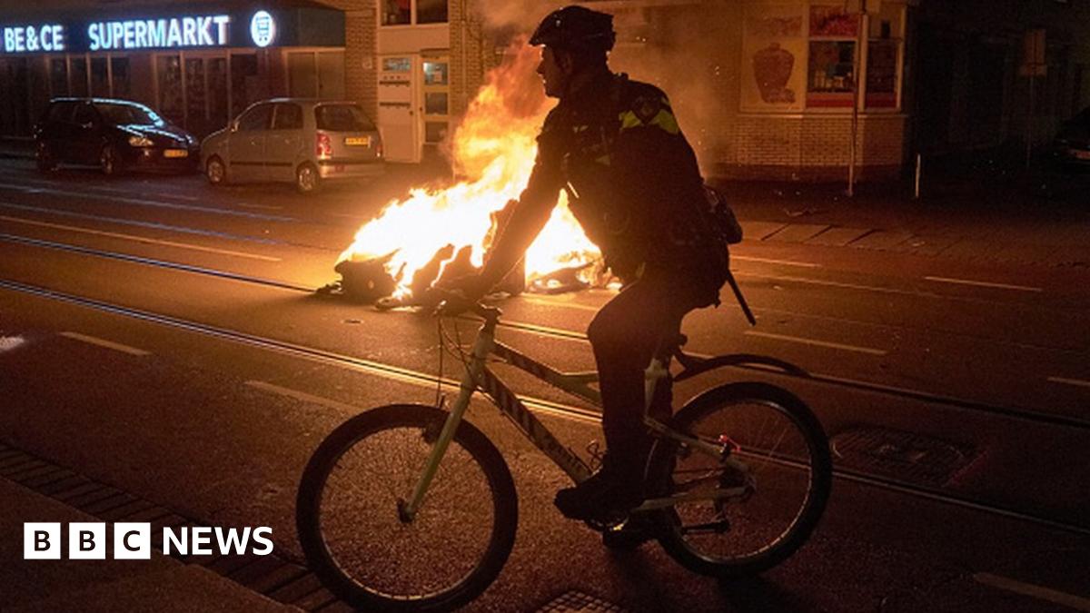 Covid: Dutch curfew riots rage for third night - BBC News