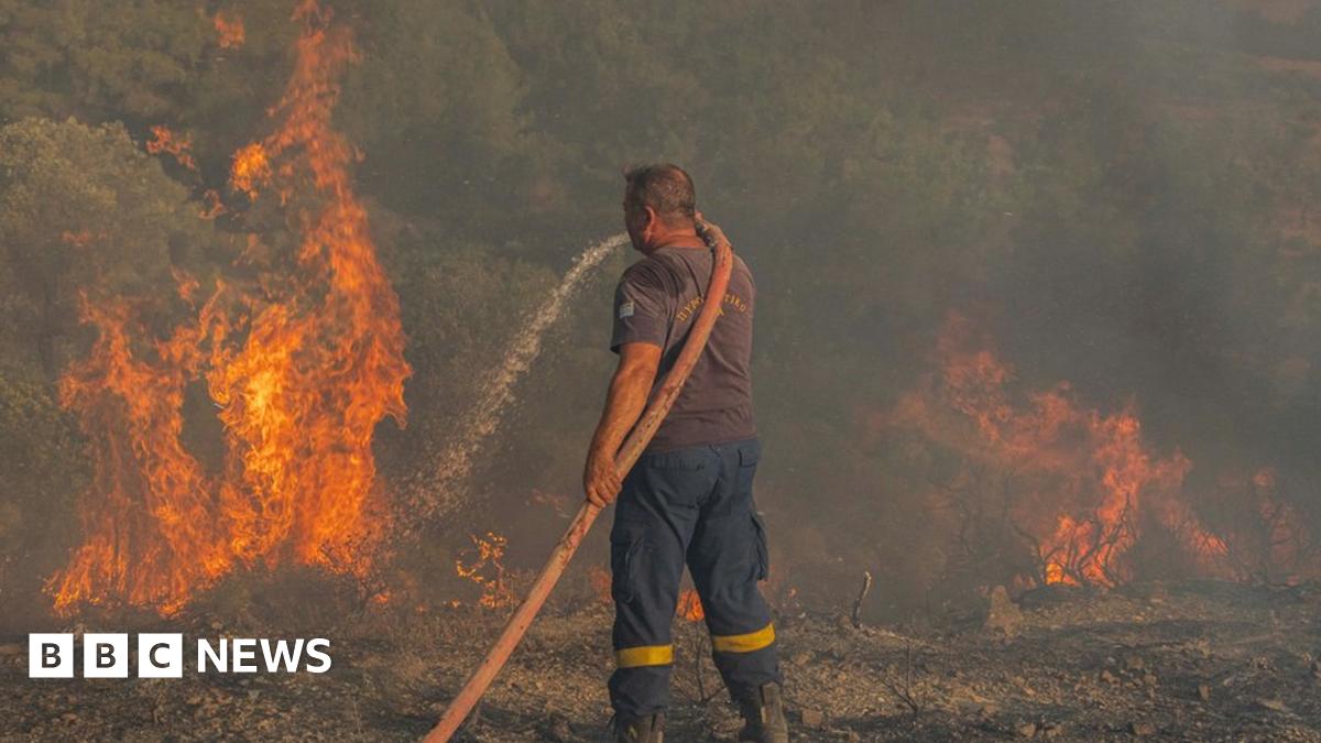 Rhodes fires: Thousands forced to flee 'disaster film' wildfires - BBC News