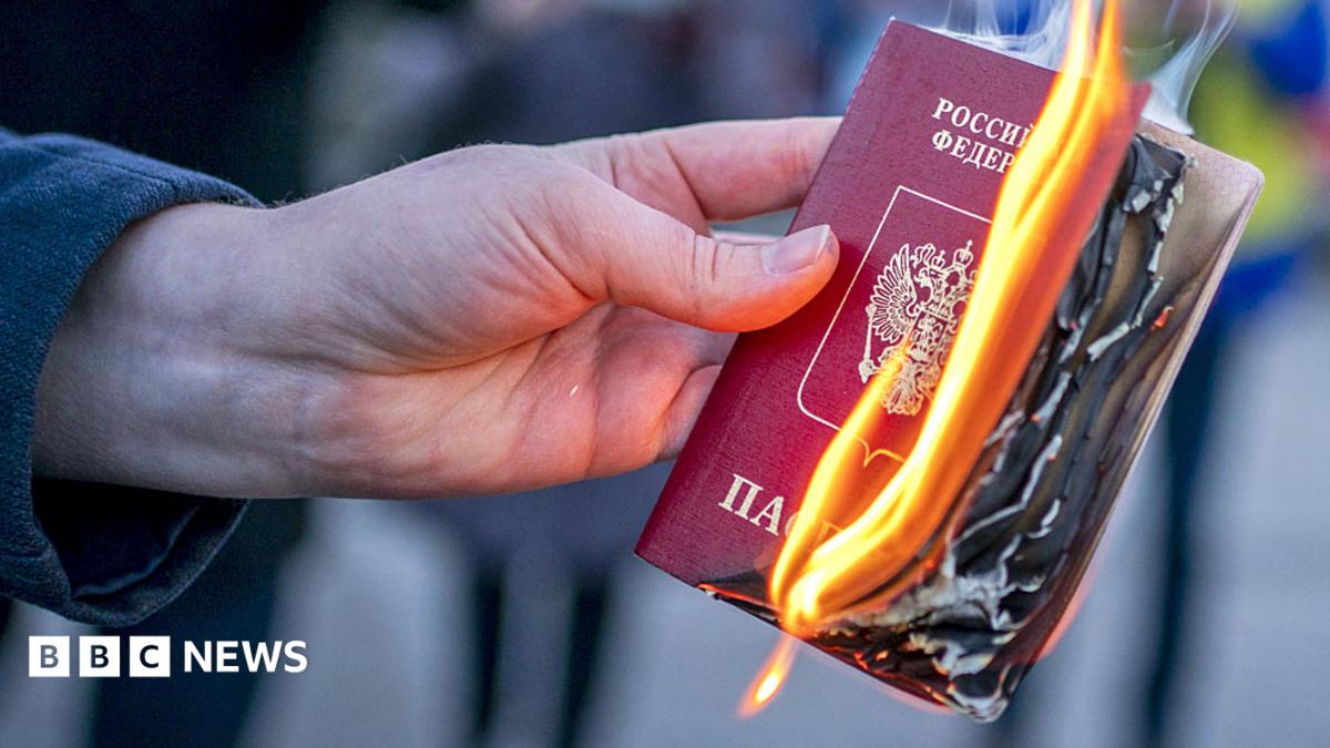 Russian activist sets fire to passport at Ukraine vigil in Edinburgh ...