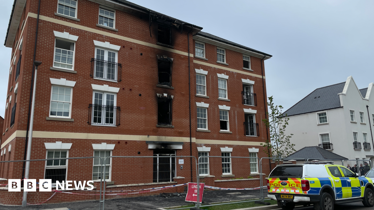 Arson investigation after fire at Sherford flat block - BBC News