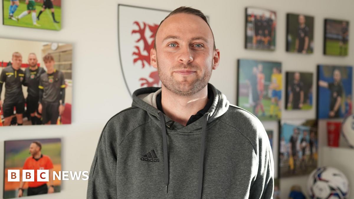 Fan steps in after referee falls injured at Cardiff City game - BBC News
