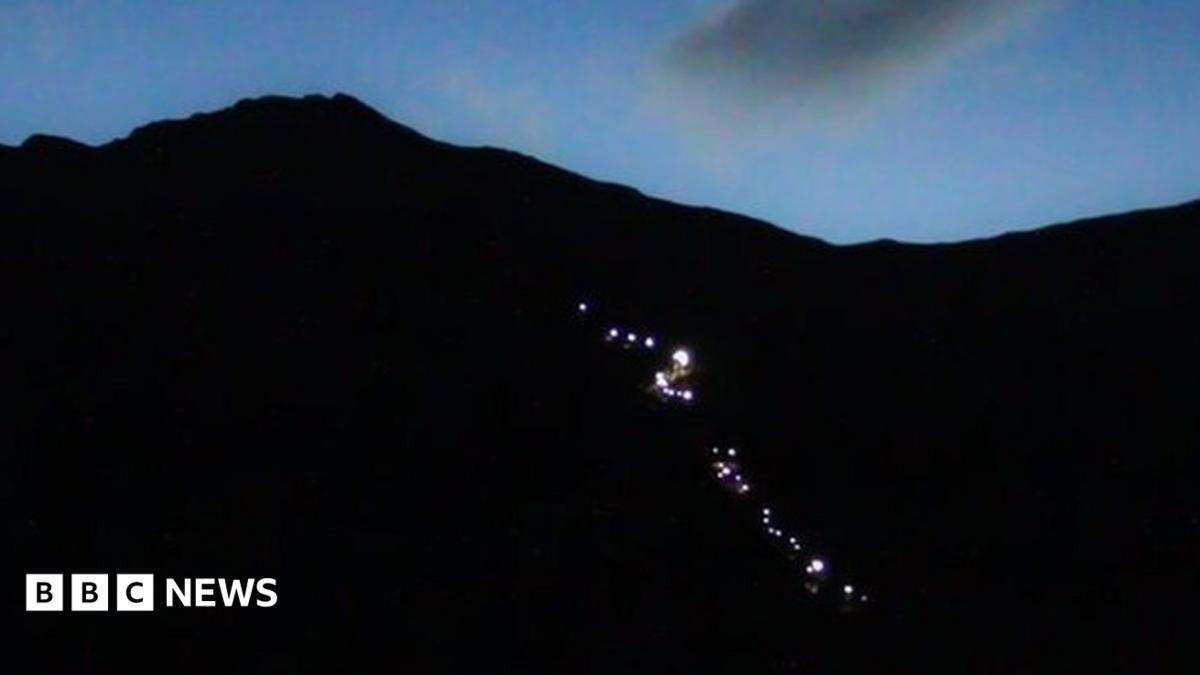 Hundreds of walkers set to create light spectacle for charity - BBC News