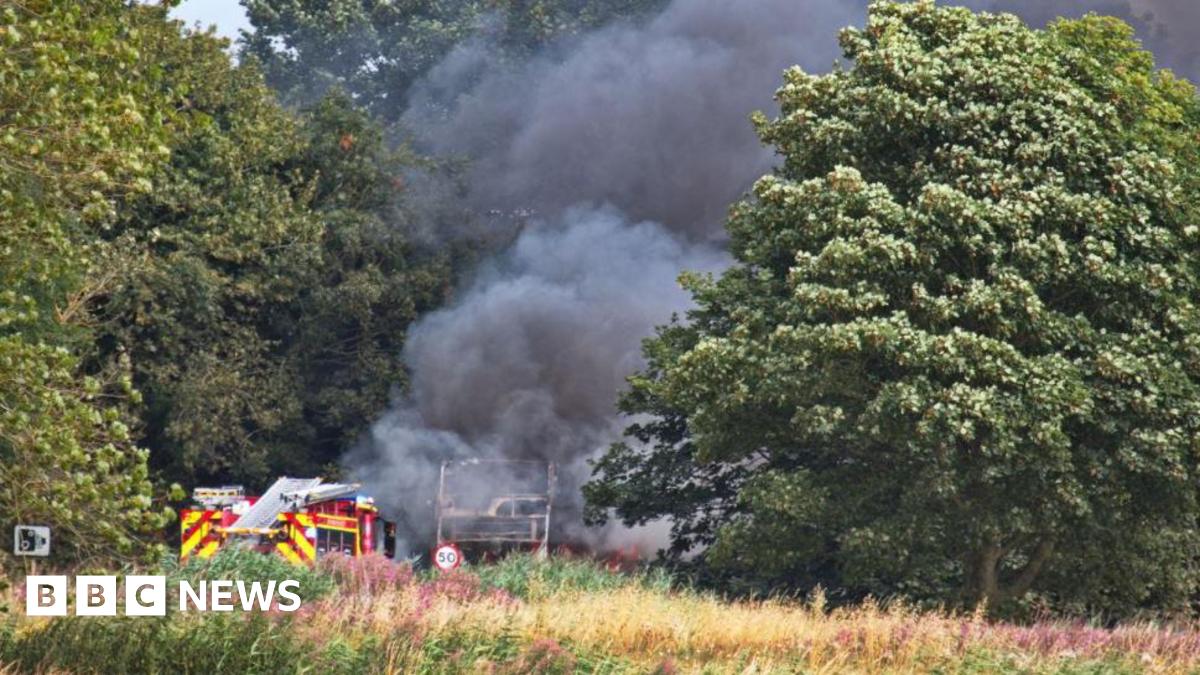 Bus evacuated after it catches fire on the A52 near Friskney - BBC News