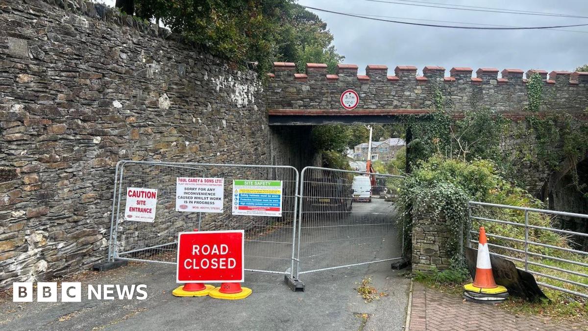 Partial wall collapse closes road in Laxey for two months - BBC News