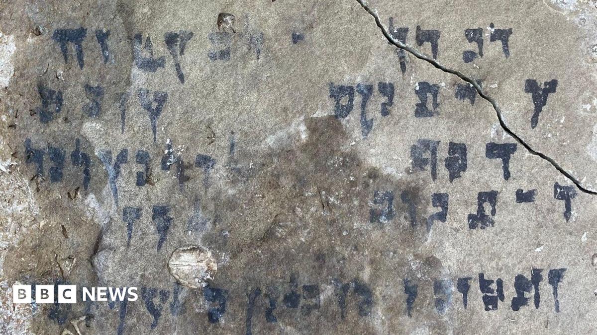 Mystery of inscription found written under Shropshire patio slab - BBC News