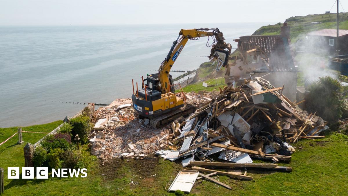 Trimingham farmhouse teetering over cliff edge demolished - BBC News