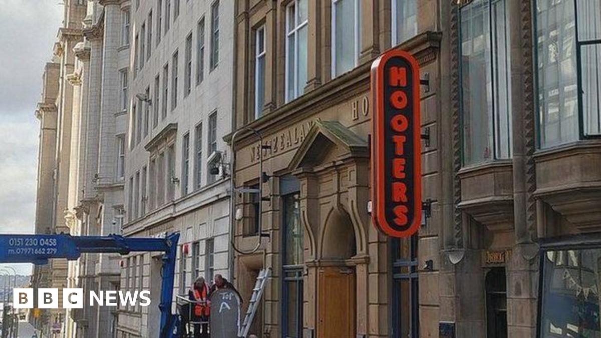 Ex-Hooters boss fined over 'eyesore' orange signs in Liverpool - BBC News