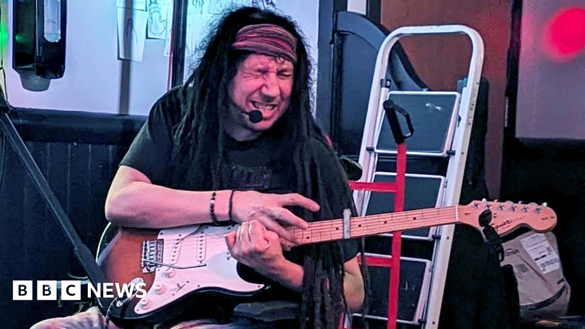 'I've learned to play guitar with one arm after a stroke' - BBC News