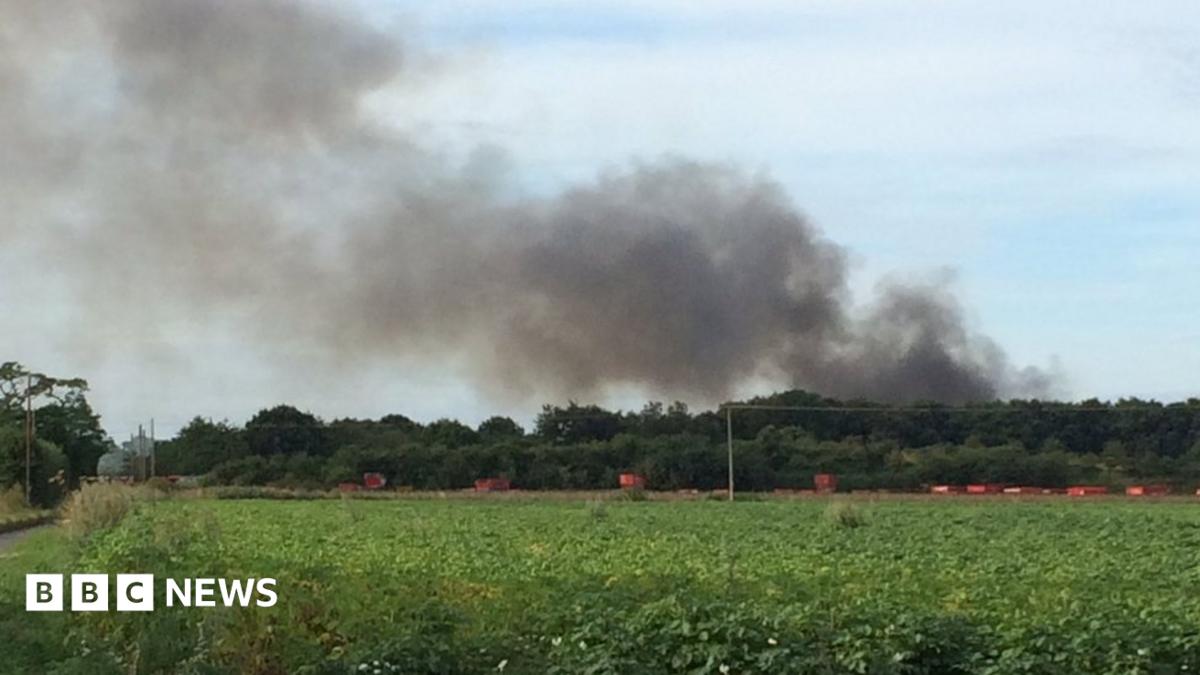 West Dereham scrap yard fire 'could burn for days' - BBC News