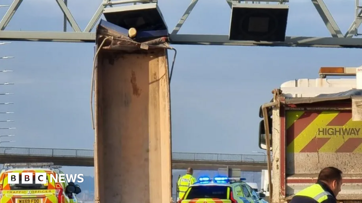 Driver who wedged lorry under M5 gantry admits it was 'careless' - BBC News