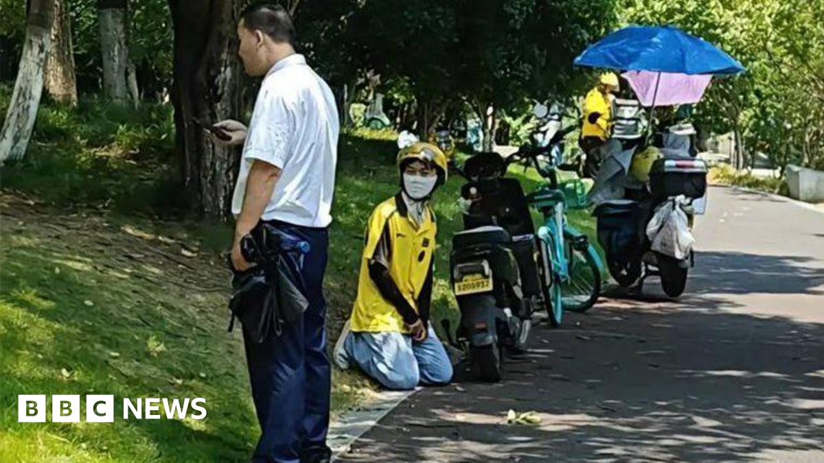 Protests in China as delivery rider kneels before security guard - BBC News