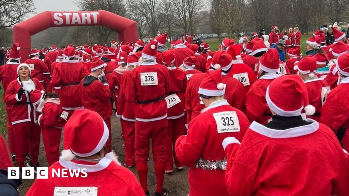 Derby Santa Run: Hundreds of festive runners race through park - BBC News