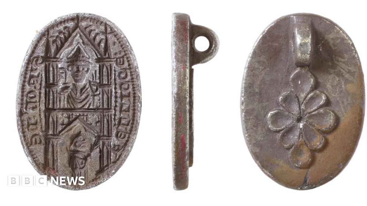 Medieval silver seal matrix found in Norfolk declared treasure - BBC News