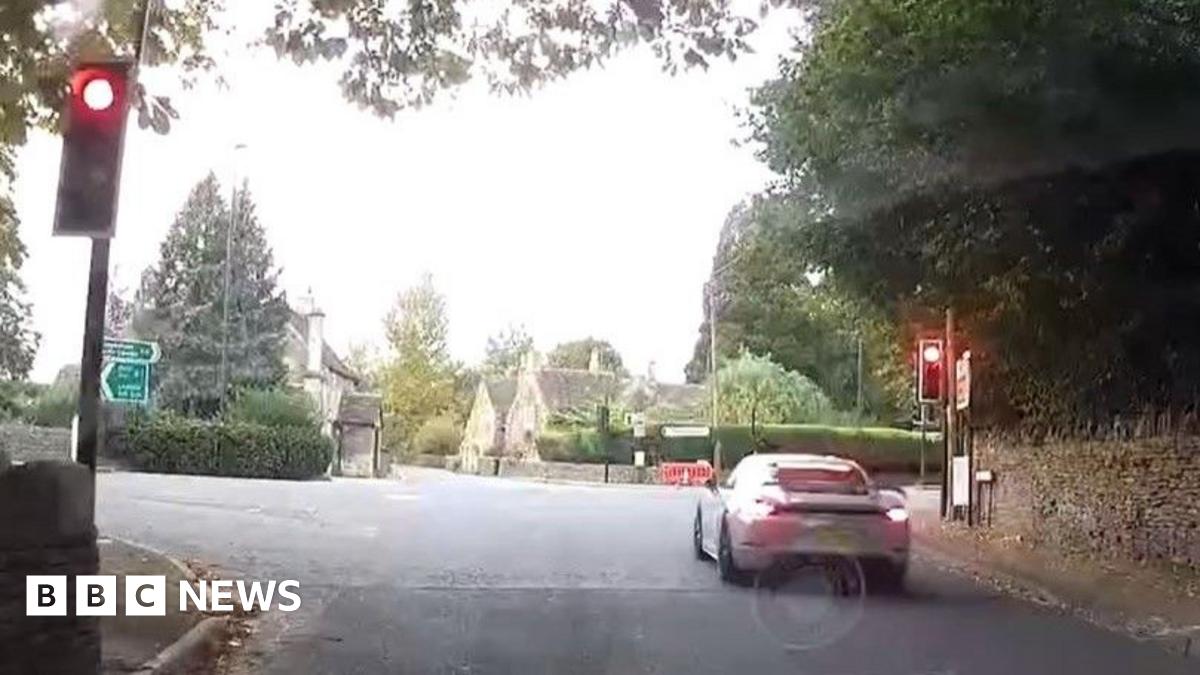 Footage shows man racing through red light at busy junction - BBC News