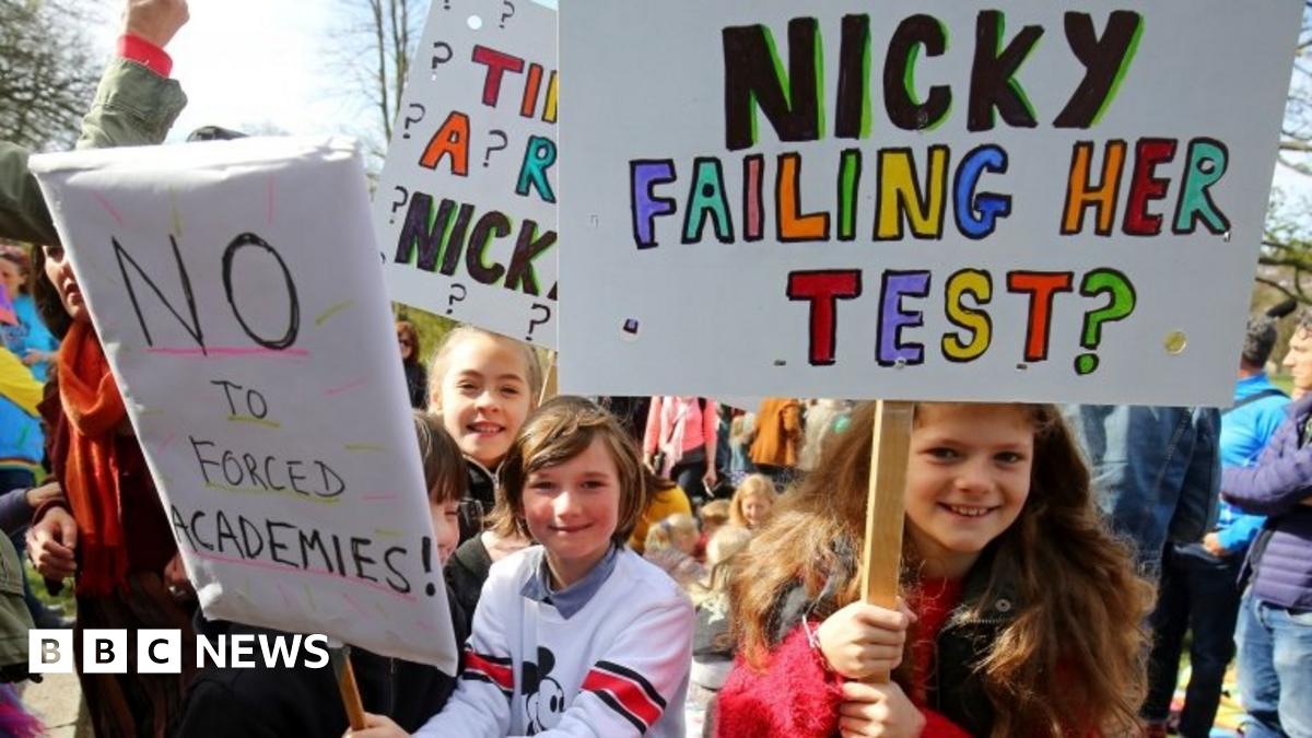 Parents keep children off school in test protest - BBC News
