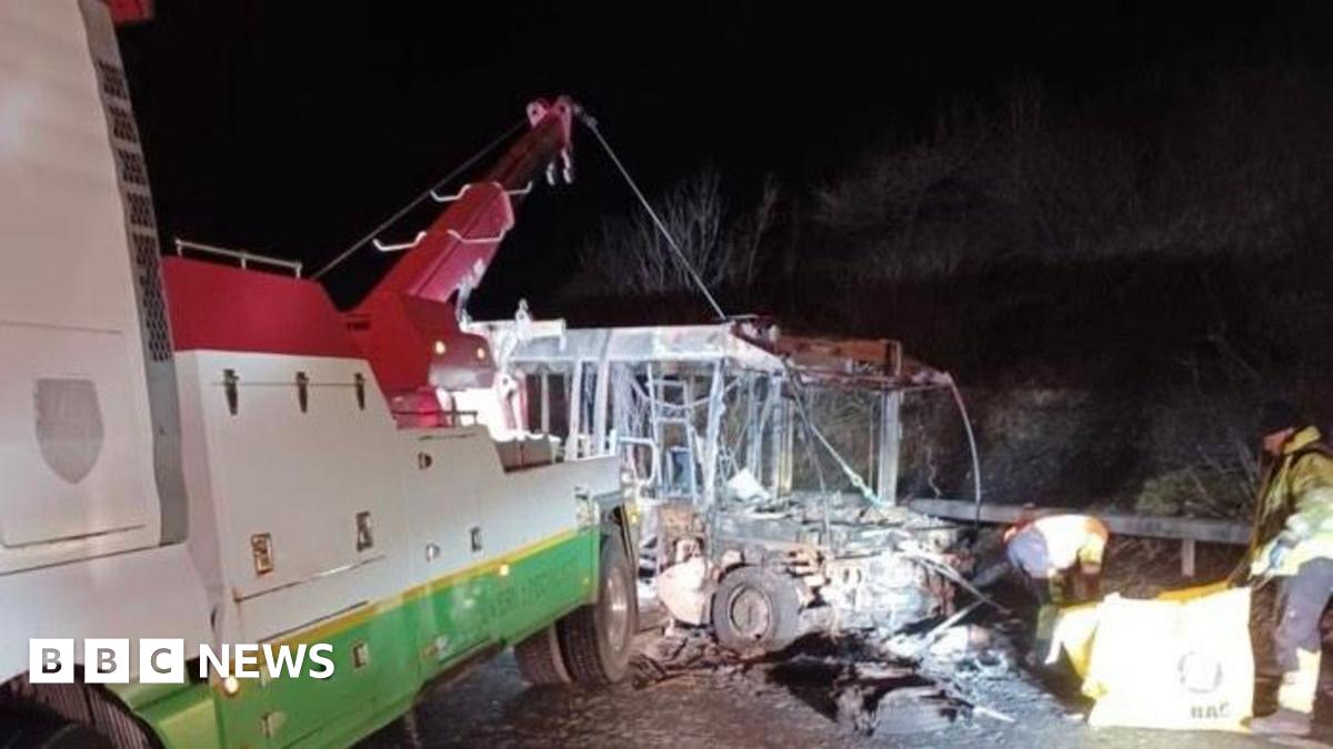 A30 carriageway closed as firefighters tackle bus blaze - BBC News