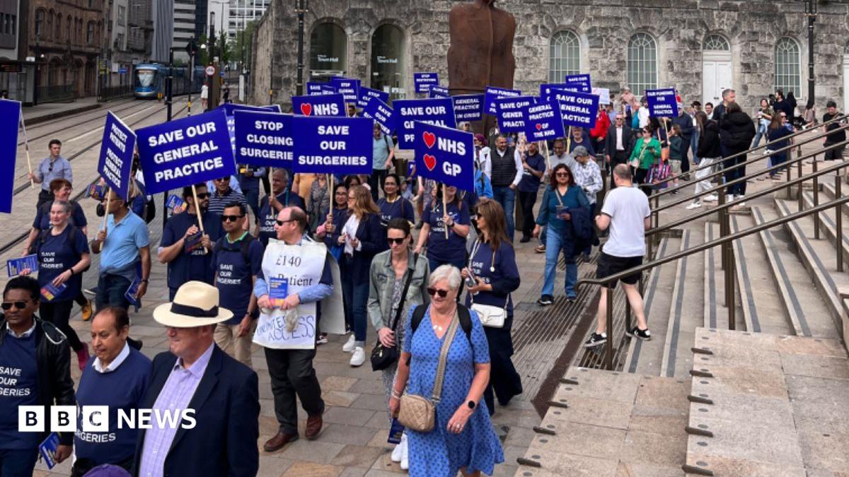 More than 100 GPs protest in Birmingham in pay row - BBC News