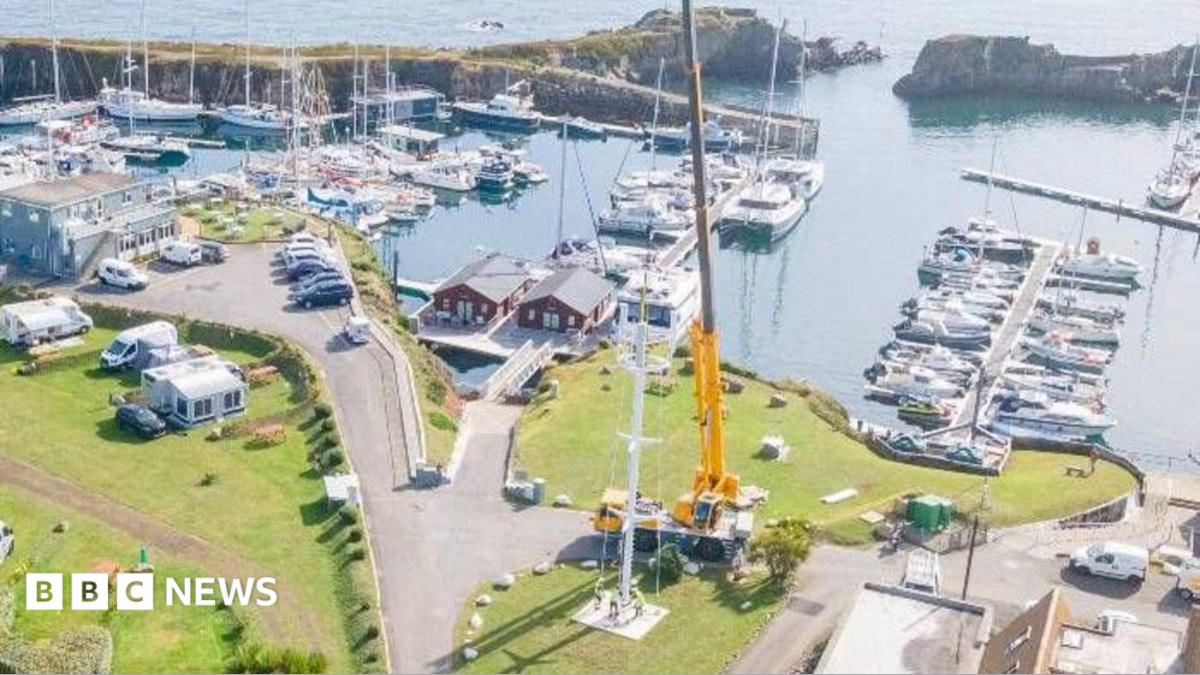 Guernsey mobile tower is designed to look like a yacht mast - BBC News