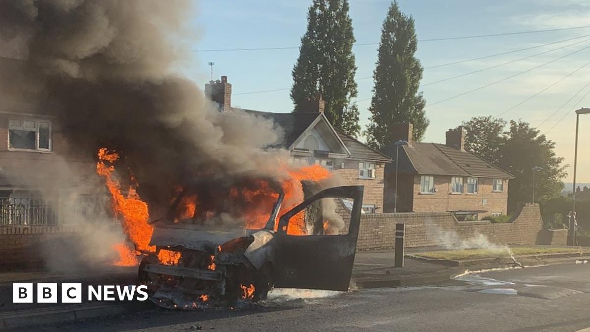 Leeds police van set on fire and bricks thrown at officers - BBC News