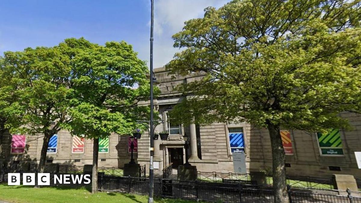 Barrow Library plans bigger fence to tackle vandals - BBC News