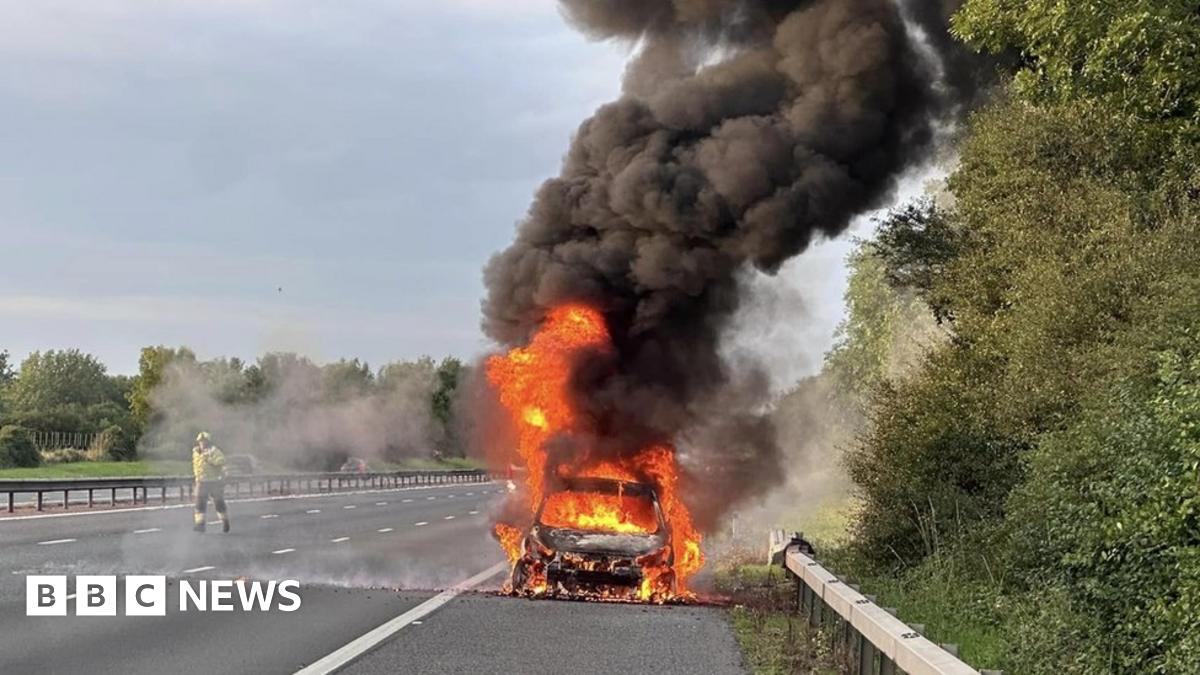 Car bursts into flames on M40 motorway hard shoulder - BBC News