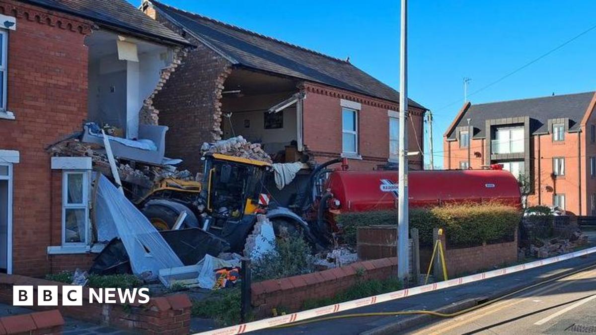 Chester tractor pulling tanker smashes into terraced homes after crash - BBC News