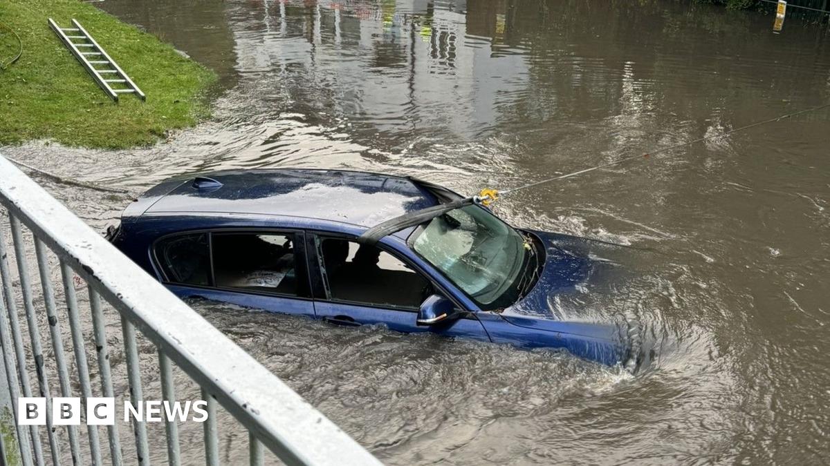 UK flooding: Cars and rail lines submerged as more rain forecast - BBC News