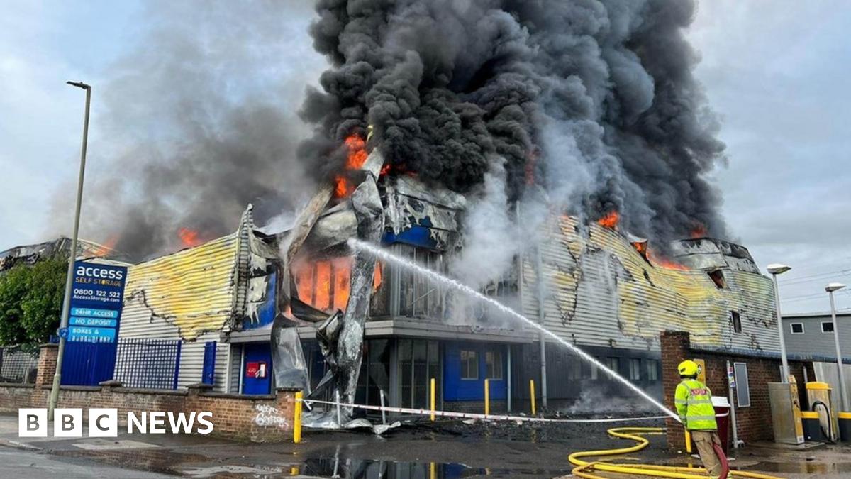 Byfleet storage depot fire investigation 'will take weeks' - BBC News