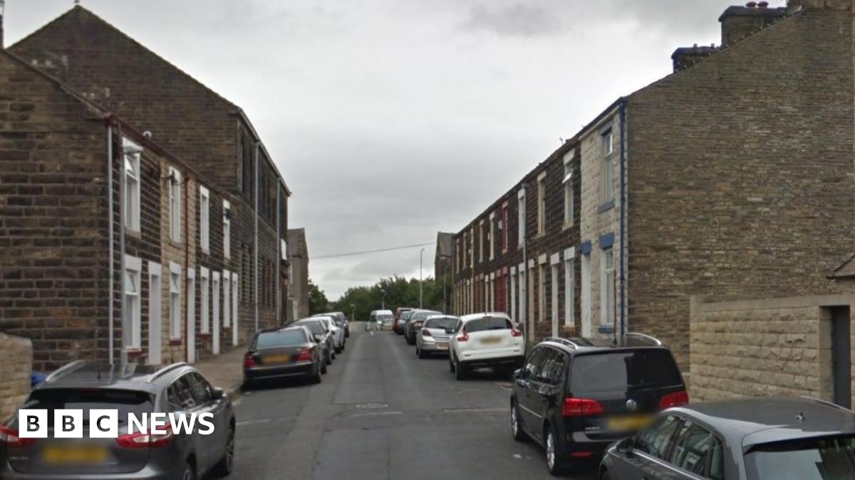 Nelson house fire: Man charged with wounding with intent - BBC News